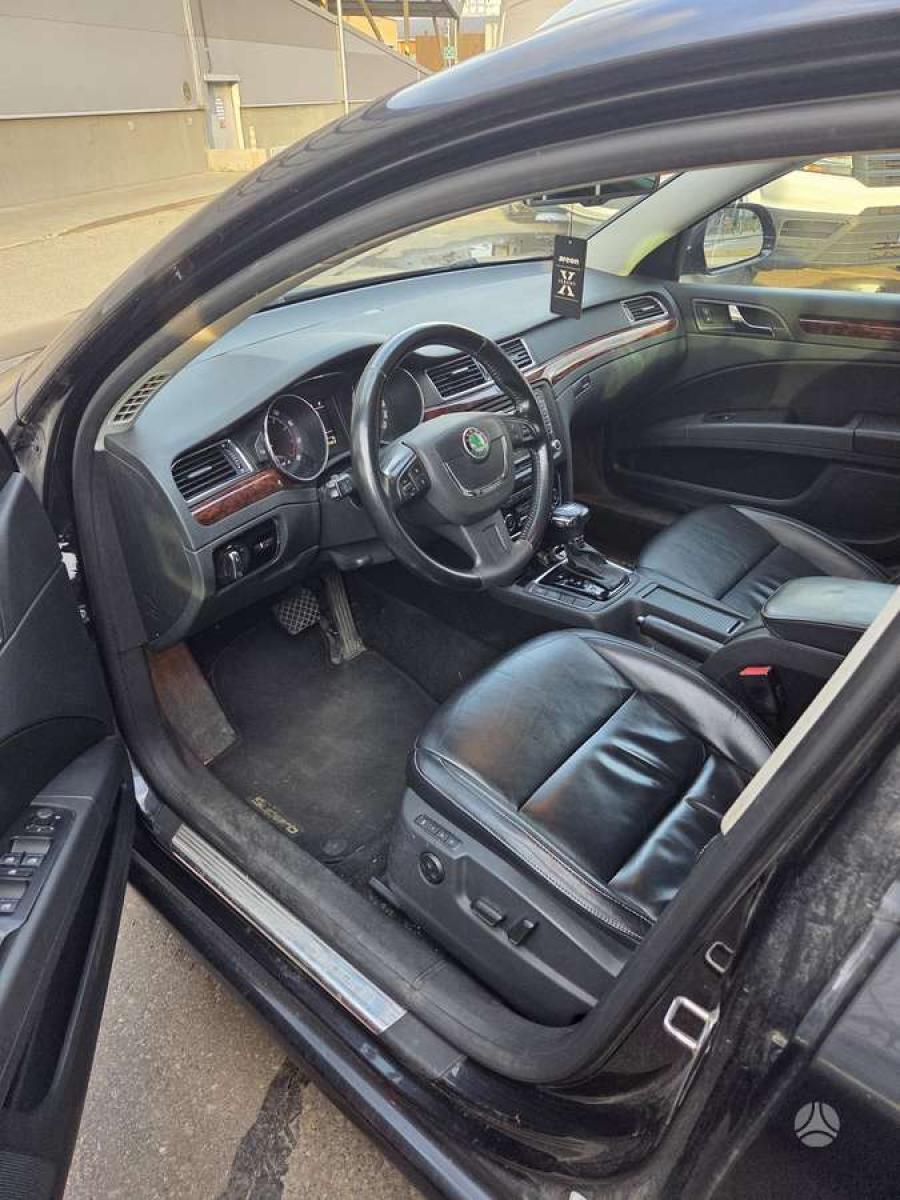 Black Skoda SuperB 2012 in Vilnius, with an engine capacity of 1.98 L and mileage of 313 thousand km for 6300 €, photo 16 on AUTOMOTO.COM.LV