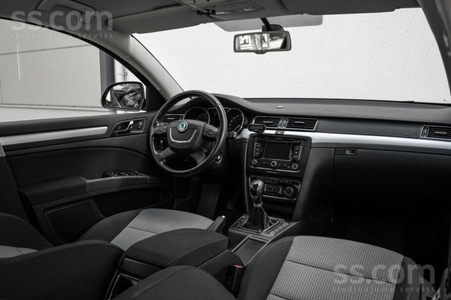Black Skoda SuperB 2012 in Riga, with an engine capacity of 1.60 L and mileage of 242 thousand km for 5250 €, photo 13 on AUTOMOTO.COM.LV