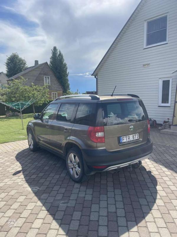Brown Skoda Yeti 2012 in Rokiskis, with an engine capacity of 1.97 L and mileage of 230 thousand km for 4900 €, photo 6 on AUTOMOTO.COM.LV