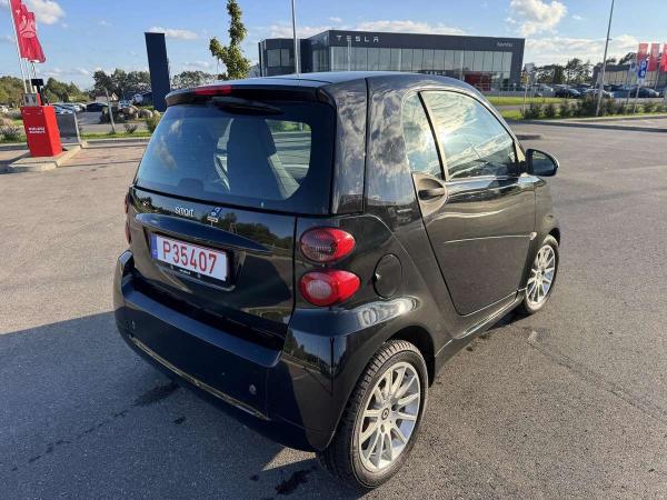 Black Smart Fortwo 2012 in Vilnius, with an engine capacity of 1.00 L and mileage of 90 thousand km for 3850 €, photo 6 on AUTOMOTO.COM.LV