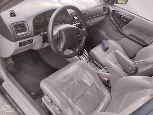 Black Subaru Forester 1998 in Silute, with an engine capacity of 2.00 L and mileage of 264 thousand km for 3650 €, photo 6 on AUTOMOTO.COM.LV