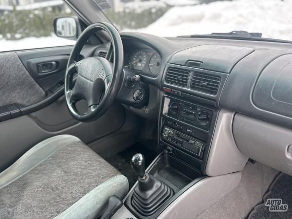 Black Subaru Forester 2000 in Vilnius, with an engine capacity of 2.00 L and mileage of 340 thousand km for 1950 €, photo 9 on AUTOMOTO.COM.LV