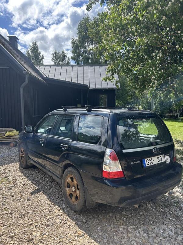 Black Subaru Forester 2007 in Riga, with an engine capacity of 2.00 L and mileage of 301 thousand km for 1900 €, photo 1 on AUTOMOTO.COM.LV