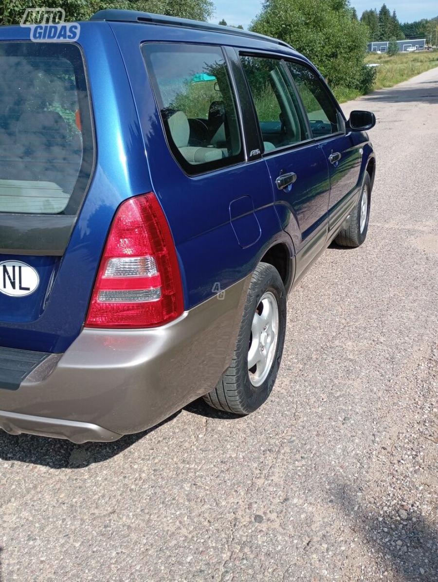 Blue Subaru Forester 2003 in Utena, with an engine capacity of 2.00 L and mileage of 279 thousand km for 3750 €, photo 12 on AUTOMOTO.COM.LV