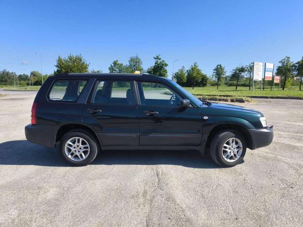 Green Subaru Forester 2004 in Panevezys, with an engine capacity of 1.99 L and mileage of 250 thousand km for 2800 €, photo 6 on AUTOMOTO.COM.LV
