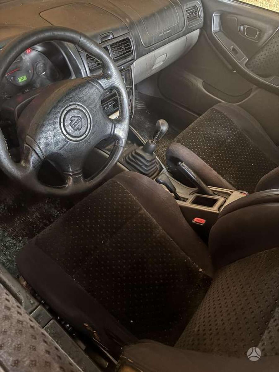 Pelēks Subaru Forester 2002 Kauņa, ar dzinēja tilpumu 2.00 L un nobraukumu 320 tūkst. km par 450 €, foto 7 vietnē AUTOMOTO.COM.LV