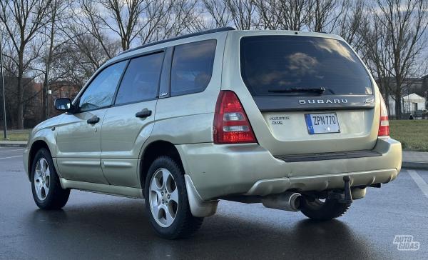 Yellow Subaru Forester 2005 in Siauliai, with an engine capacity of 2.50 L and mileage of 140 thousand km for 1750 €, photo 6 on AUTOMOTO.COM.LV