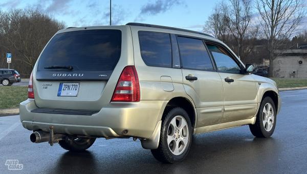 Yellow Subaru Forester 2005 in Siauliai, with an engine capacity of 2.50 L and mileage of 140 thousand km for 1750 €, photo 7 on AUTOMOTO.COM.LV