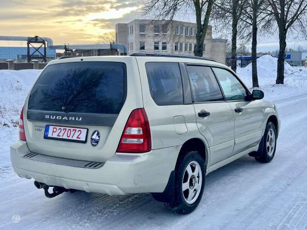 Yellow Subaru Forester 2005 in Silute, with an engine capacity of 2.00 L and mileage of 328 thousand km for 2999 €, photo 4 on AUTOMOTO.COM.LV