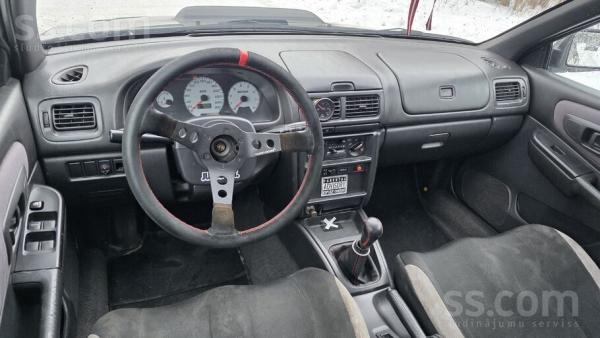 Black Subaru Impreza 1998 in Riga, with an engine capacity of 2.00 L and mileage of 295 thousand km for 7500 €, photo 3 on AUTOMOTO.COM.LV