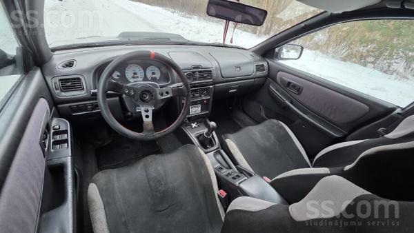 Black Subaru Impreza 1998 in Riga, with an engine capacity of 2.00 L and mileage of 295 thousand km for 7500 €, photo 6 on AUTOMOTO.COM.LV