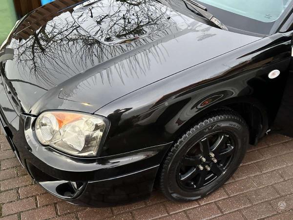 Black Subaru Impreza 2003 in Vilnius, with an engine capacity of 2.00 L and mileage of 258 thousand km for 1300 €, photo 4 on AUTOMOTO.COM.LV
