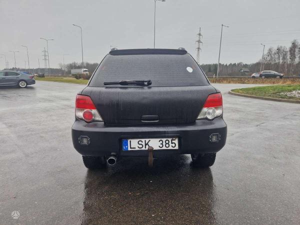Black Subaru Impreza 2004 in Kaunas, with an engine capacity of 2.00 L and mileage of 138 thousand km for 3450 €, photo 6 on AUTOMOTO.COM.LV