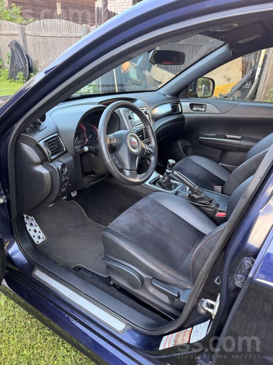 Blue Subaru Impreza 2010 in Riga, with an engine capacity of 2.50 L and mileage of 255 thousand km for 23999 €, photo 7 on AUTOMOTO.COM.LV