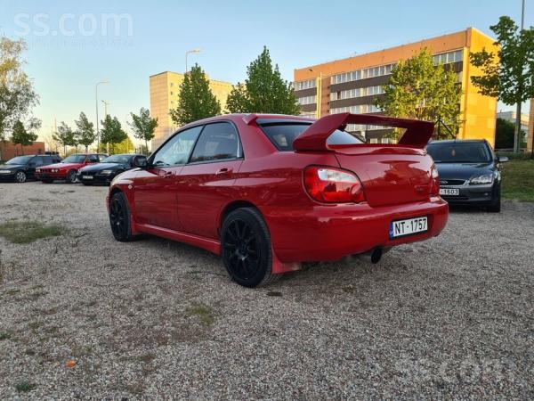 Red Subaru Impreza 2003 in Liepaja, with an engine capacity of 2.00 L and mileage of 165 thousand km for 7900 €, photo 3 on AUTOMOTO.COM.LV
