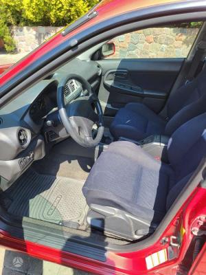 Red Subaru Impreza 2000 in Vilnius, with an engine capacity of 1.99 L and mileage of 177 thousand km for 1599 €, photo 9 on AUTOMOTO.COM.LV