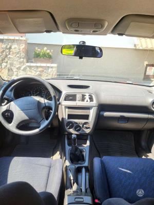 Red Subaru Impreza 2000 in Vilnius, with an engine capacity of 1.99 L and mileage of 177 thousand km for 1599 €, photo 14 on AUTOMOTO.COM.LV
