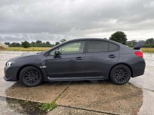 Black Subaru Impreza WRX 2015 in Riga, with an engine capacity of 2.50 L and mileage of 150 thousand km for 22000 €, photo 6 on AUTOMOTO.COM.LV