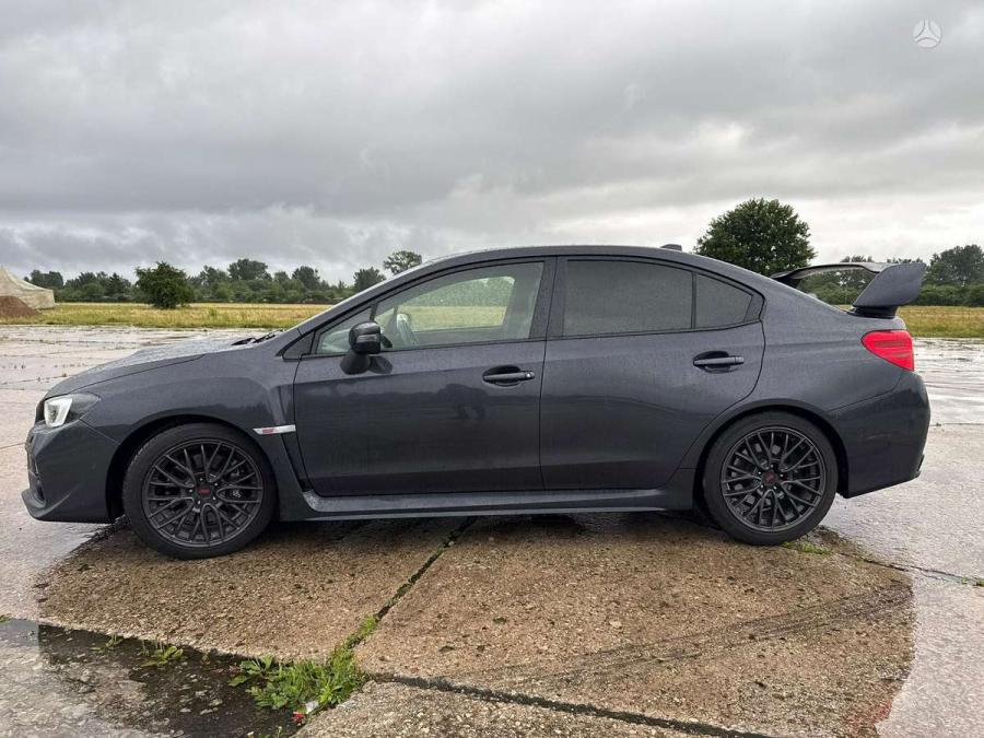Black Subaru Impreza WRX 2015 in Riga, with an engine capacity of 2.50 L and mileage of 150 thousand km for 22000 €, photo 6 on AUTOMOTO.COM.LV