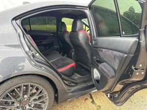 Black Subaru Impreza WRX 2015 in Riga, with an engine capacity of 2.50 L and mileage of 150 thousand km for 22000 €, photo 8 on AUTOMOTO.COM.LV