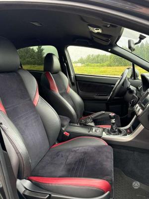 Black Subaru Impreza WRX 2015 in Riga, with an engine capacity of 2.50 L and mileage of 150 thousand km for 22000 €, photo 9 on AUTOMOTO.COM.LV