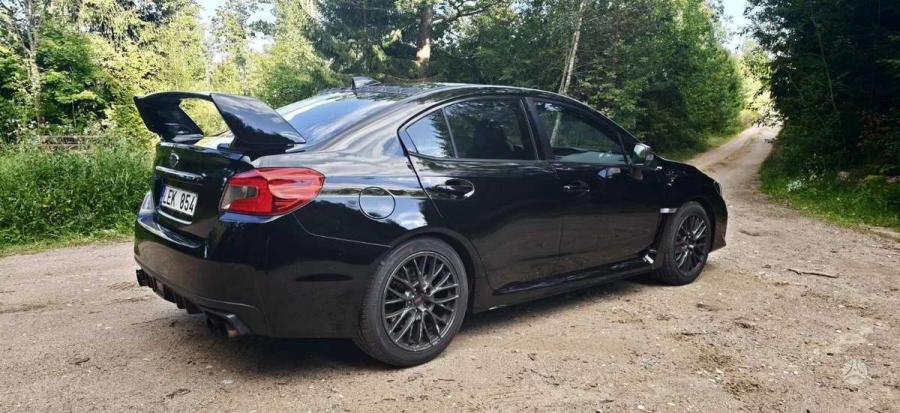Black Subaru Impreza WRX 2015 in Vilnius, with an engine capacity of 2.00 L and mileage of 116 thousand km for 13800 €, photo 4 on AUTOMOTO.COM.LV
