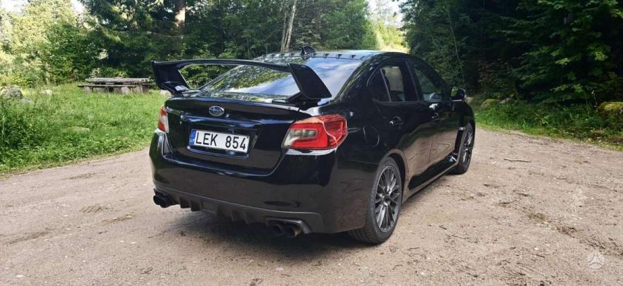 Black Subaru Impreza WRX 2015 in Vilnius, with an engine capacity of 2.00 L and mileage of 116 thousand km for 13800 €, photo 5 on AUTOMOTO.COM.LV