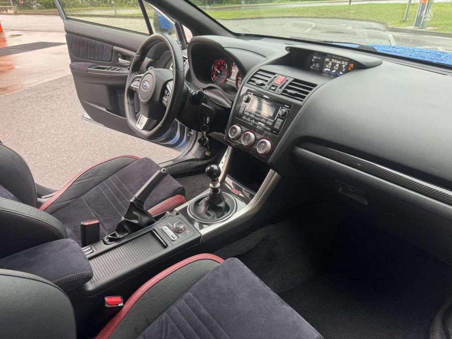 Blue Subaru Impreza WRX 2015 in Vilnius, with an engine capacity of 2.46 L and mileage of 132 thousand km for 17000 €, photo 13 on AUTOMOTO.COM.LV