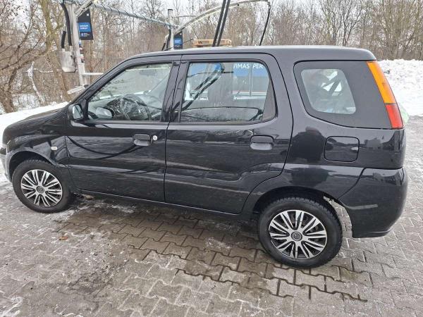 Black Subaru Justy 2006 in Panevezys, with an engine capacity of 1.33 L and mileage of 206 thousand km for 1199 €, photo 2 on AUTOMOTO.COM.LV