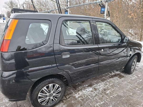 Black Subaru Justy 2006 in Panevezys, with an engine capacity of 1.33 L and mileage of 206 thousand km for 1199 €, photo 4 on AUTOMOTO.COM.LV
