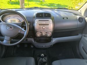 Black Subaru Justy 2007 in Klaipeda, with an engine capacity of 1.00 L and mileage of 202 thousand km for 1299 €, photo 12 on AUTOMOTO.COM.LV