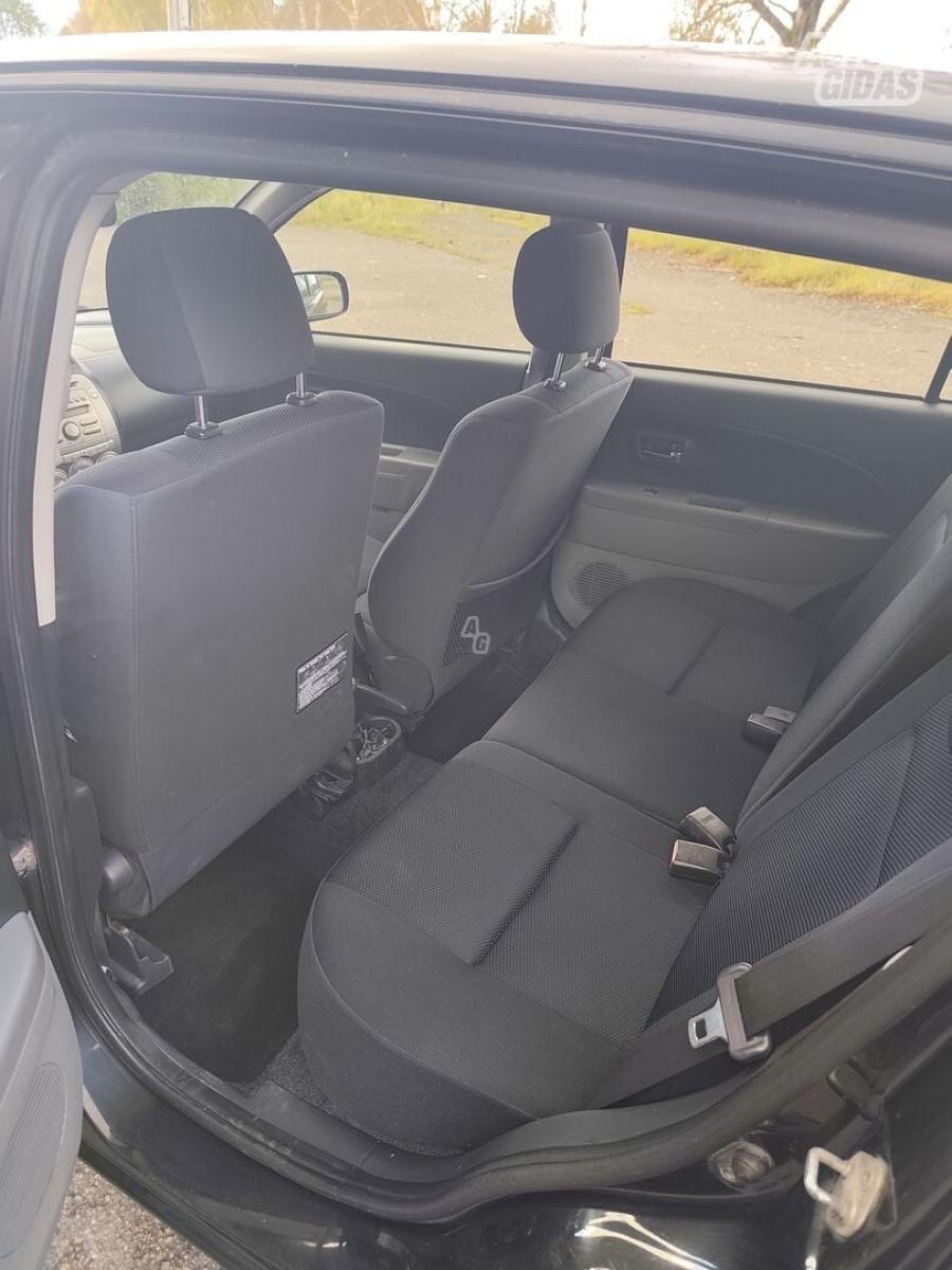 Black Subaru Justy 2009 in Silute, with an engine capacity of 1.00 L and mileage of 210 thousand km for 1650 €, photo 13 on AUTOMOTO.COM.LV