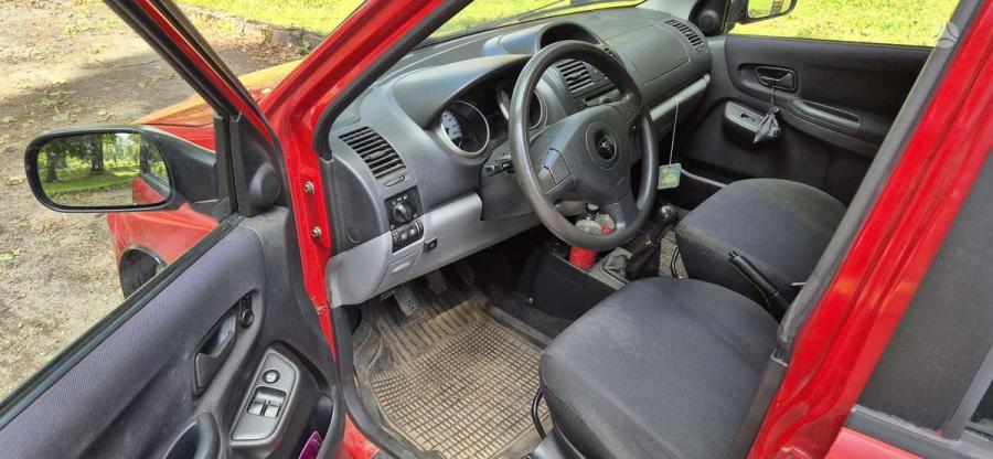 Red Subaru Justy 2006 in Vilnius, with an engine capacity of 1.33 L and mileage of 165 thousand km for 1950 €, photo 7 on AUTOMOTO.COM.LV