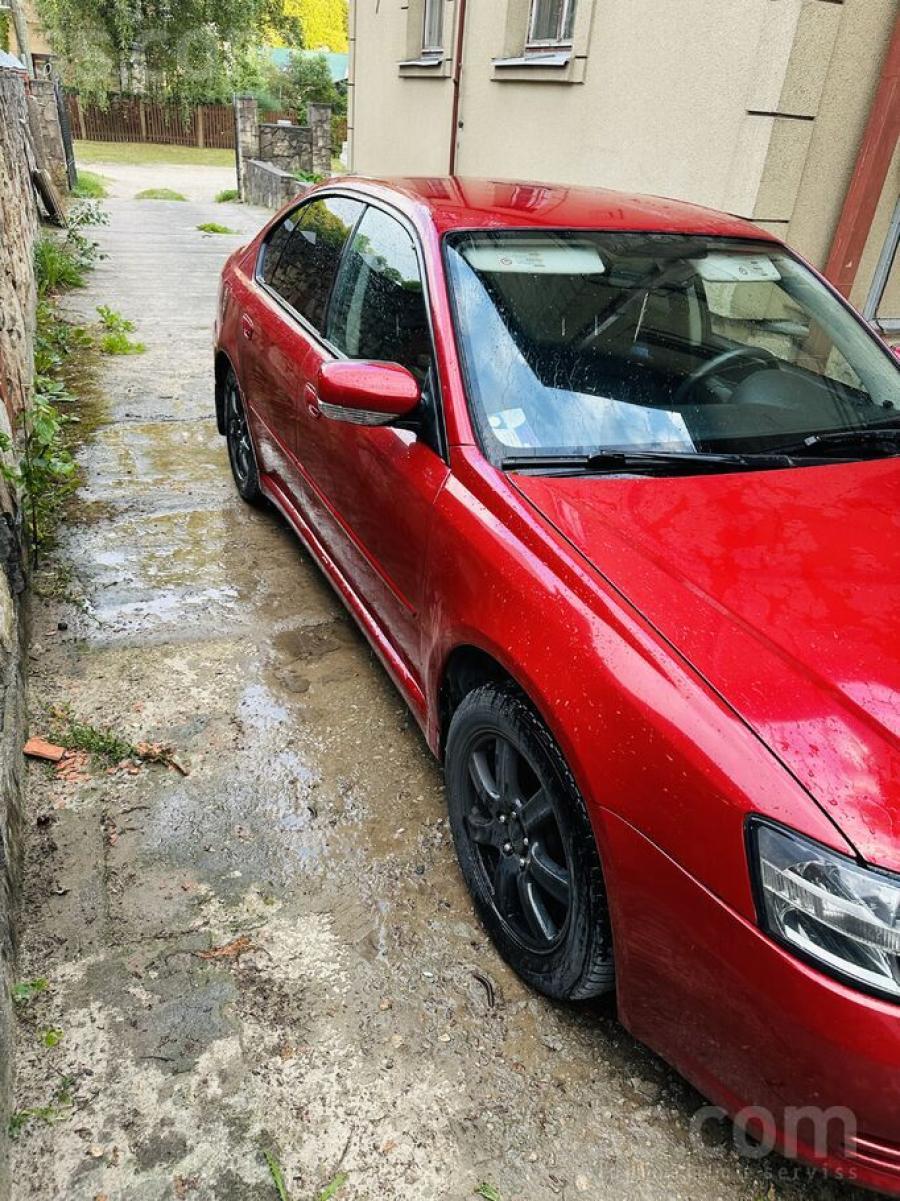 Red Subaru Legacy 2005 in Riga, with an engine capacity of 2.00 L and mileage of 298 thousand km for 1650 €, photo 1 on AUTOMOTO.COM.LV