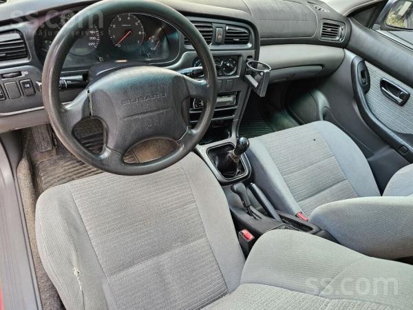 Red Subaru Legacy 2000 in Preili, with an engine capacity of 2.00 L and mileage of 277 thousand km for 2900 €, photo 6 on AUTOMOTO.COM.LV