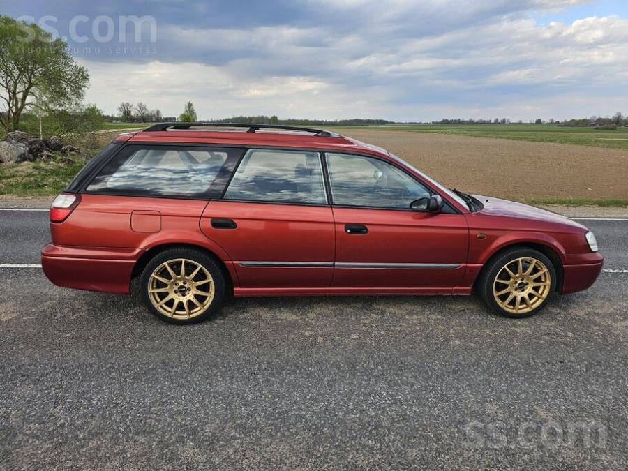 Red Subaru Legacy 2000 in Preili, with an engine capacity of 2.00 L and mileage of 277 thousand km for 2900 €, photo 1 on AUTOMOTO.COM.LV