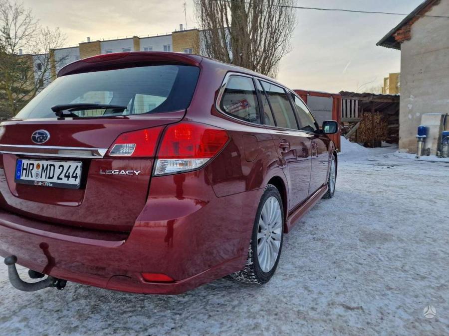 Red Subaru Legacy 2011 in Panevezys, with an engine capacity of 2.50 L and mileage of 185 thousand km for 5299 €, photo 6 on AUTOMOTO.COM.LV