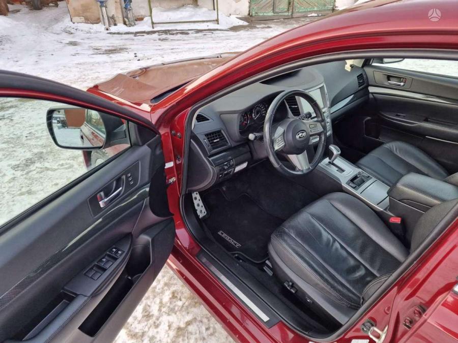 Red Subaru Legacy 2011 in Panevezys, with an engine capacity of 2.50 L and mileage of 185 thousand km for 5299 €, photo 18 on AUTOMOTO.COM.LV