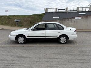 White Subaru Legacy 1995 in Anyksciai, with an engine capacity of 2.00 L and mileage of 211 thousand km for 750 €, photo 4 on AUTOMOTO.COM.LV