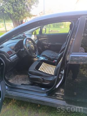 Black Subaru XV 2012 in Valmiera, with an engine capacity of 1.60 L and mileage of 192 thousand km for 6450 €, photo 4 on AUTOMOTO.COM.LV