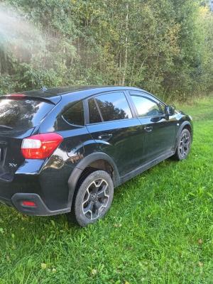 Black Subaru XV 2012 in Valmiera, with an engine capacity of 1.60 L and mileage of 192 thousand km for 6450 €, photo 6 on AUTOMOTO.COM.LV