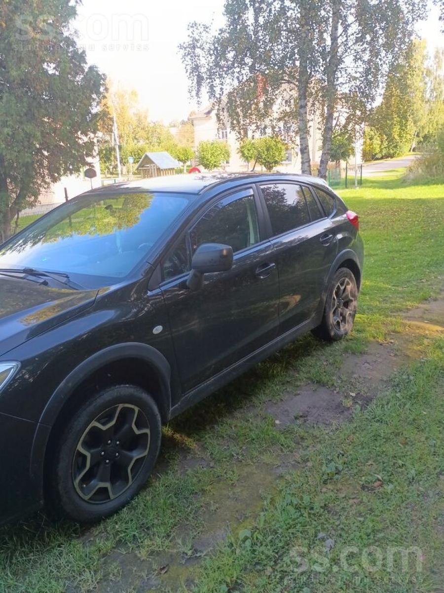 Black Subaru XV 2012 in Valmiera, with an engine capacity of 1.60 L and mileage of 192 thousand km for 6450 €, photo 7 on AUTOMOTO.COM.LV