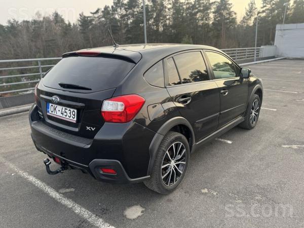 Black Subaru XV 2013 in Riga, with an engine capacity of 2.00 L and mileage of 215 thousand km for 7650 €, photo 2 on AUTOMOTO.COM.LV