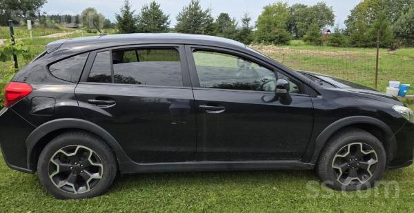 Black Subaru XV 2013 in Riga, with an engine capacity of 1.60 L and mileage of 218 thousand km for 5500 €, photo 1 on AUTOMOTO.COM.LV