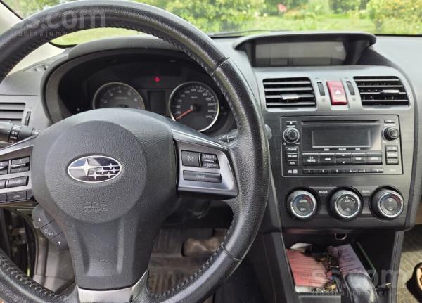 Black Subaru XV 2013 in Riga, with an engine capacity of 1.60 L and mileage of 218 thousand km for 5500 €, photo 4 on AUTOMOTO.COM.LV