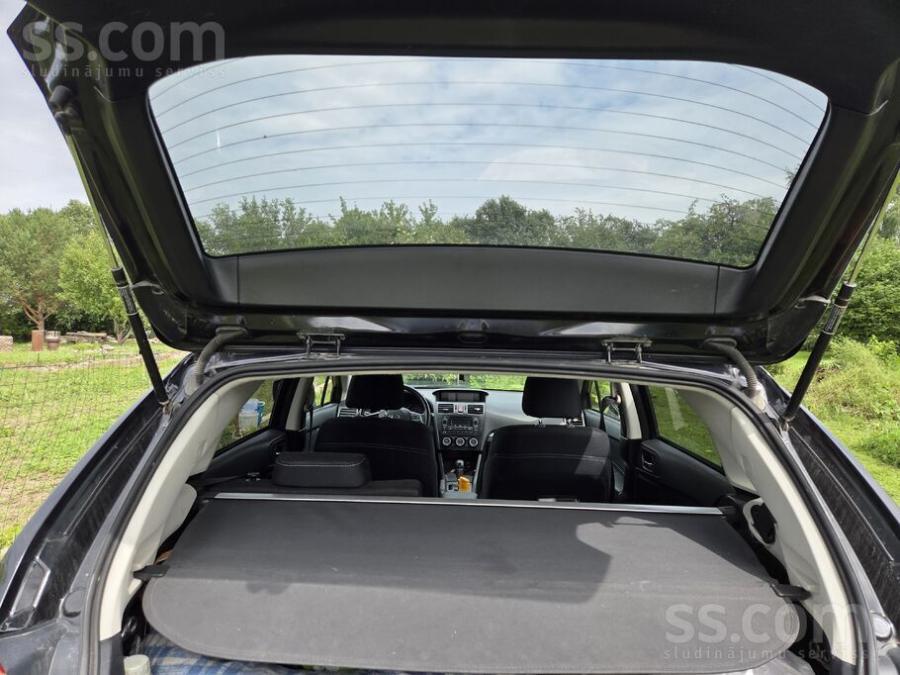 Black Subaru XV 2013 in Riga, with an engine capacity of 1.60 L and mileage of 200 thousand km for 5500 €, photo 4 on AUTOMOTO.COM.LV