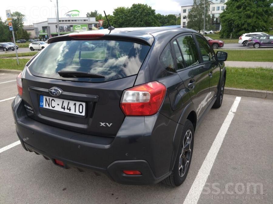 Black Subaru XV 2014 in Riga, with an engine capacity of 2.00 L and mileage of 218 thousand km for 6600 €, photo 4 on AUTOMOTO.COM.LV