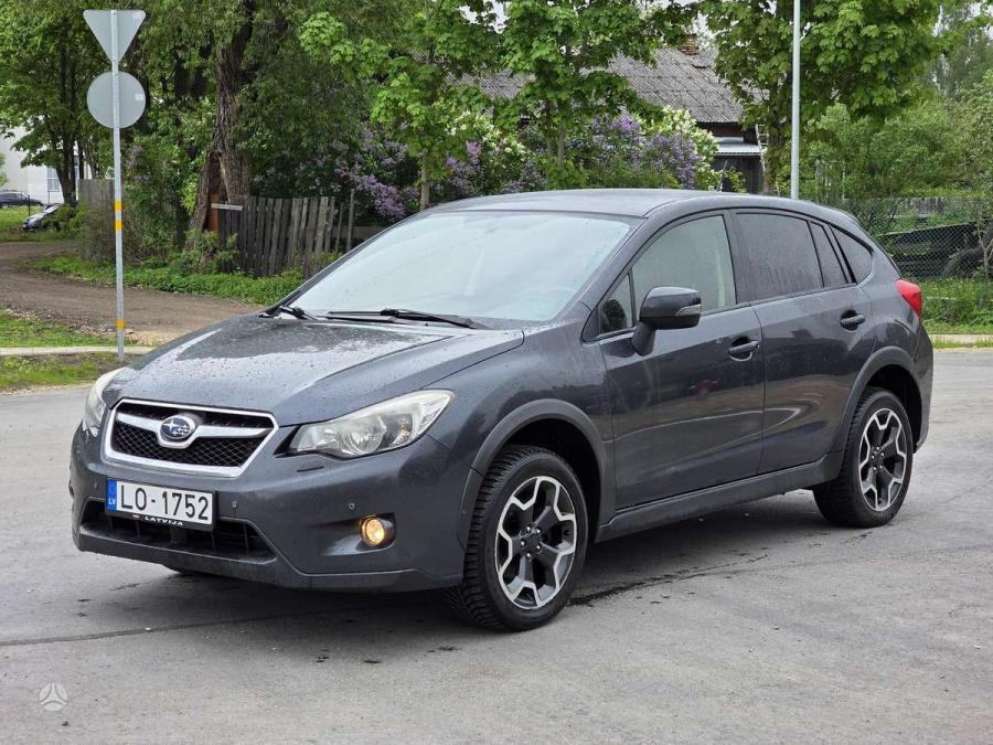 Black Subaru XV 2014 in Riga, with an engine capacity of 2.00 L and mileage of 282 thousand km for 5300 €, photo 1 on AUTOMOTO.COM.LV