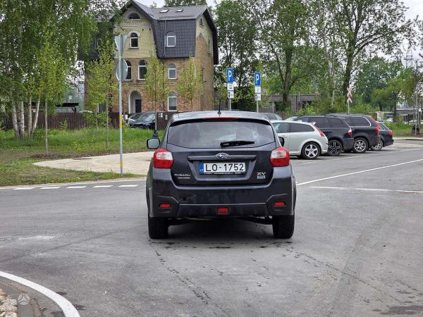 Black Subaru XV 2014 in Riga, with an engine capacity of 2.00 L and mileage of 282 thousand km for 5300 €, photo 5 on AUTOMOTO.COM.LV