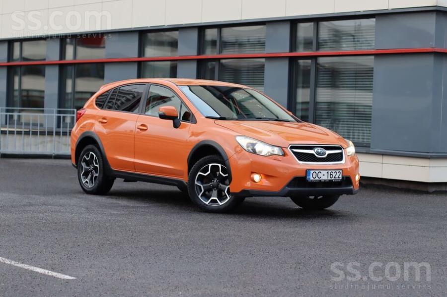 Orange Subaru XV 2012 in Riga, with an engine capacity of 2.00 L and mileage of 213 thousand km for 5980 €, photo 1 on AUTOMOTO.COM.LV